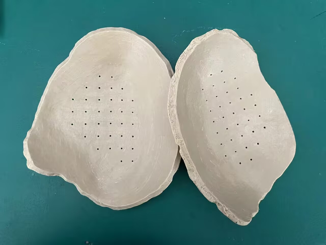 3D Printing Cranial Repair Implant Materials: PEEK vs. Titanium