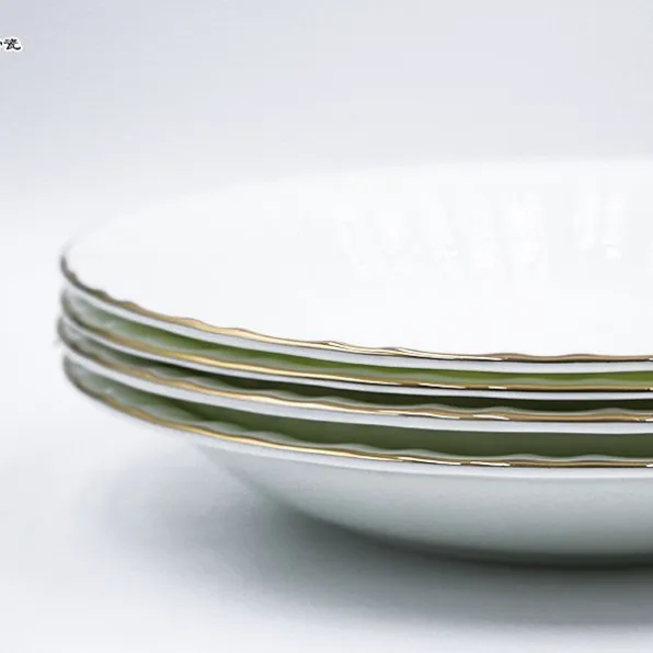 Bone china soup plate with gold rim