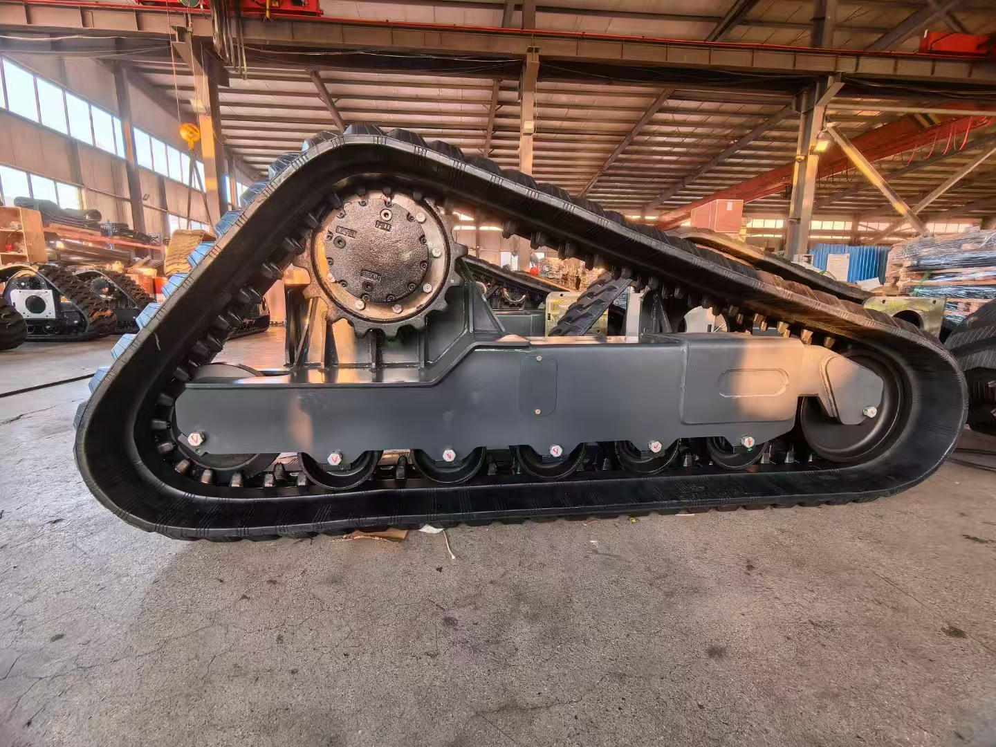 Triangular Track Undercarriage for Skid Steer Loaders.